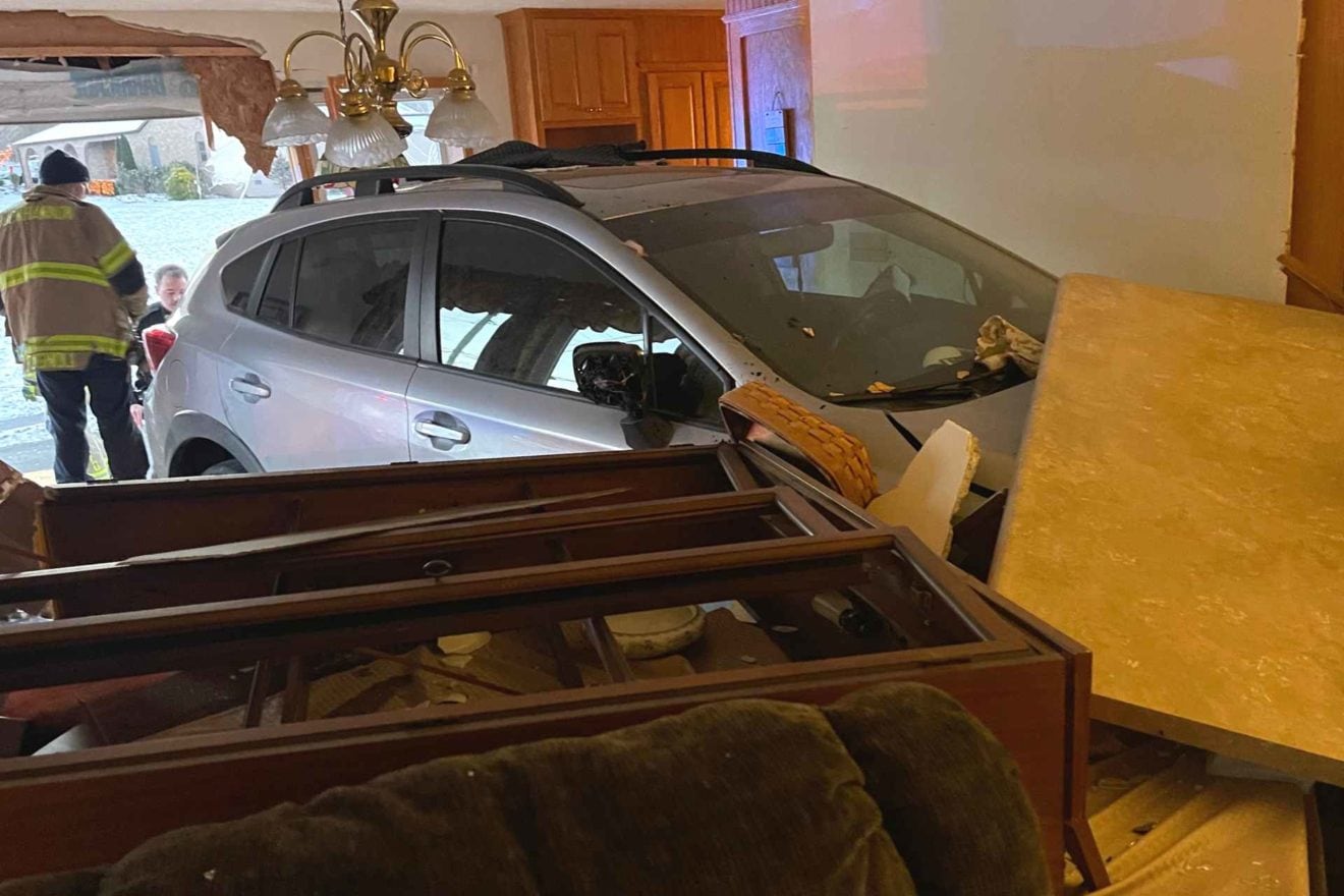 Car goes airborne into a home on Tallmansville Road early Monday morning